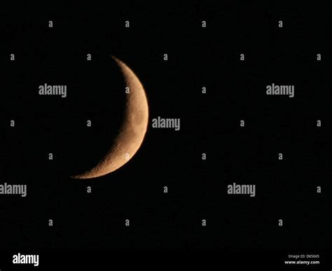 A Waxing Crescent Moon In The Dark Night Sky Capturing The Phase Of