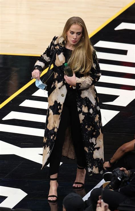 Adele Sports A Floor Length Coat During Rare Appearance At An Nba Game