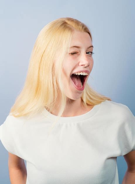 Premium Photo Woman Isolated On White Background Winking Funny Young