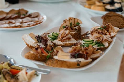 Gourmet Appetizer Platter Featuring Assorted Canapes And Deli Meats