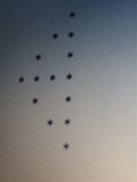 The Image Contains A Pattern Of Asterisks Arranged In A Triangular Shape The Question Likely