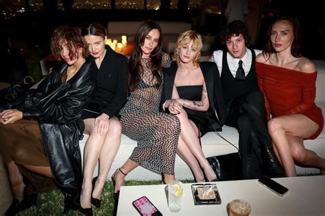 Zoë Kravitz In Orange At Saint Laurent Vanity Fair Pre Oscar Party