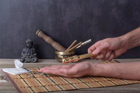 Traditional Chinese Moxibustion Therapy Applying Burning Moxa Stick On