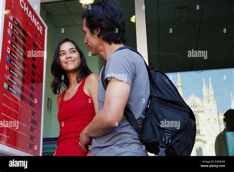 Couple Checking Currency Exchange Rates Stock Photo Alamy