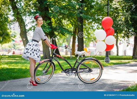 Beautiful Young Woman Retro Pin Up Style With Bicycle Stock Image