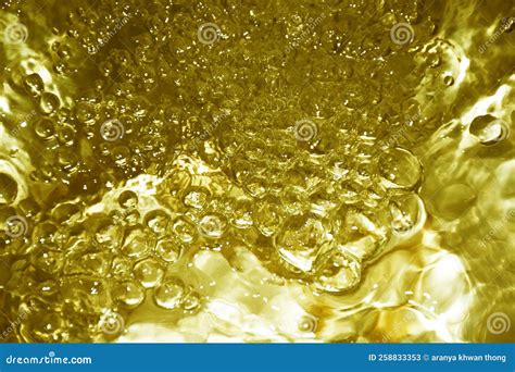 Clear Golden Yellow Water With Bubbles For Design And Background Stock