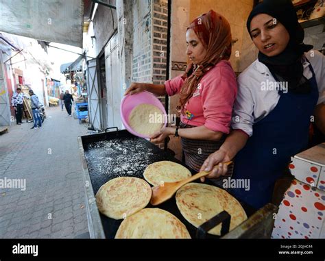 Moroccan Women Preparing Traditional Moroccan Bread In A Small Shop At