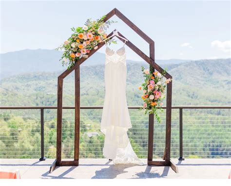 Wedding Dress On Stand Hanging The Dress On A Wooden Arch Wedding