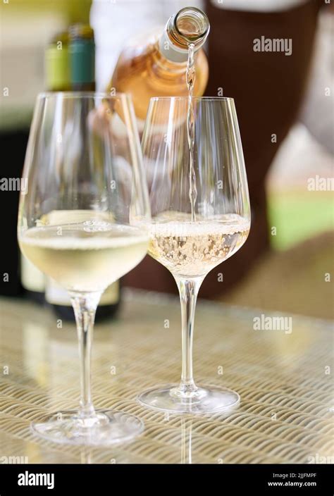 Try Our House Wine An Unrecognisable Waiter Pouring Wine Into A Glass