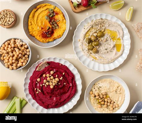 Different Types Of Hummus In Bowls And Plates Beetroot Pumpkin