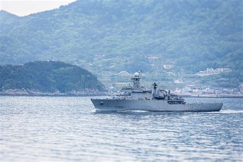 A South Korean Navy Frigate In Grey Camouflage Returns To Base After A