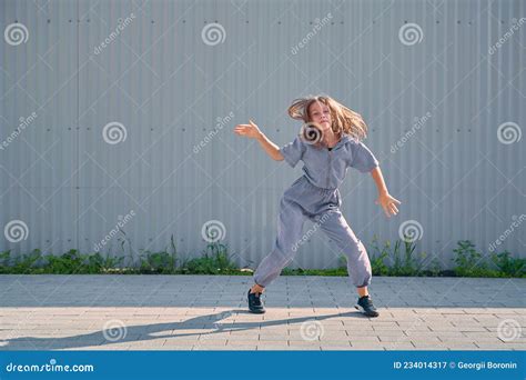 Dancing Teen Girl Showing Hip Hop Dance On Urban Background Energetic