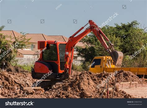 Backhoe Digging A Hole