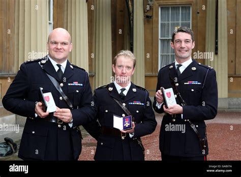 Royal Marine Major Ewen Murchison L Receives His Mbe With Lt Col Matthew Holmes Who Receives A