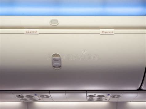 Hand Luggage Compartment In Cabin Economy Class On The Low Cost