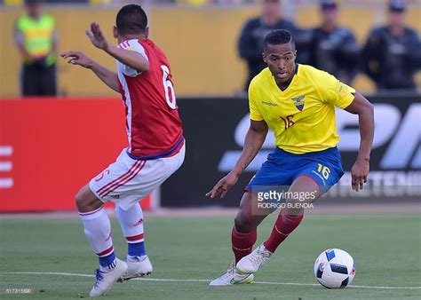 Ecuadors Antonio Valencia Eludes Paraguays Miguel Samudio During Manchester United Fc