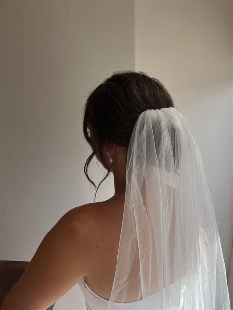Clean Textured Bun Hair Up Wedding Styles With Veil Wedding Bridal