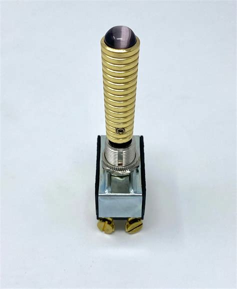 Ribbed Gold Toggle Switch Extension With Gemstone Diamond Logo