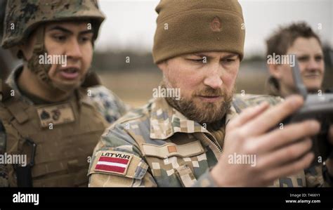 Latvian Army Staff Sgt Gatis Indrevics A Combat Cameraman With The