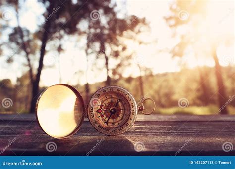 A Compass Over Wooden Table At Sunset Light Stock Image Image Of