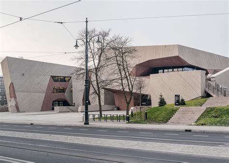 Fernando Menis Cavernous Concert Hall In Poland Uses Crushed Brickwork