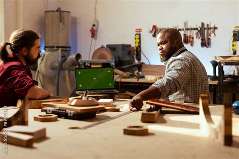 Carpenter Talking With Client About Commissioned Furniture Assembling Job Presenting On Mockup