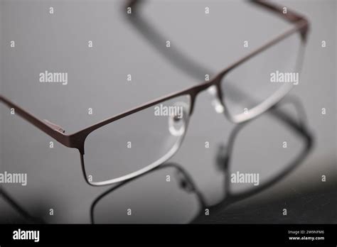 Reading Glasses Isolated On Mirror Background High Resolution Photo