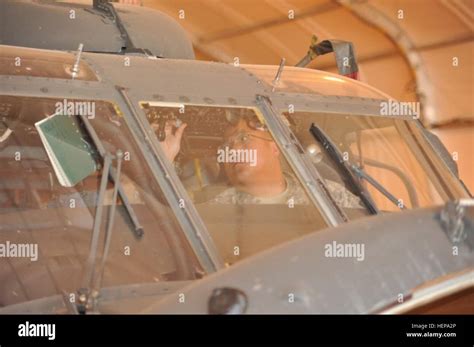 Spc Garry Yang From Bravo Company 640th Aviation Support Battalion Works On The Cockpit And