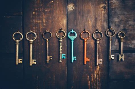 Premium Photo An Array Of Vintage Keys Laid Out On A Rustic Wooden