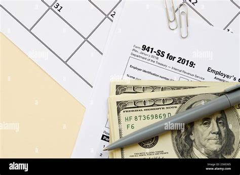 Irs Form 941 Ss Employers Quarterly Federal Tax Return Blank Lies With Pen And Many Hundred