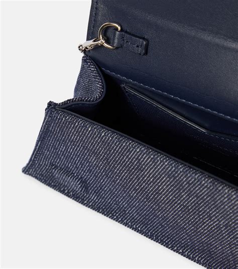 Superamini Yigit Denim Clutch In Blue Amina Muaddi Mytheresa