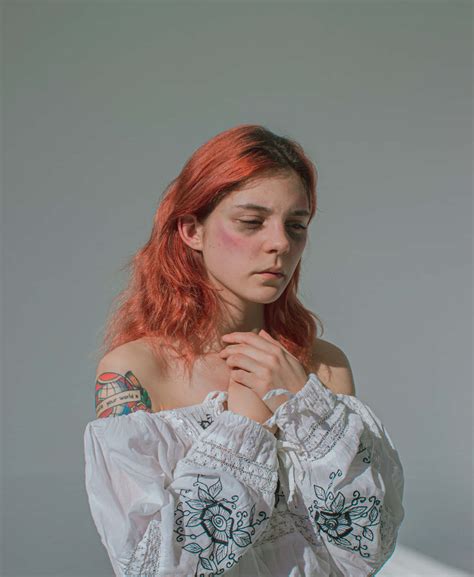 Download Bruised Redhead Girl Wallpaper