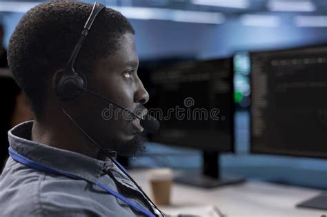 It Support Worker In Data Center Talking In Headphones Mic Doing