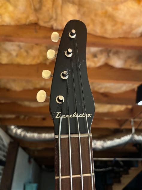 Danelectro Flat Black Bass With Dolphin Head Stock Short Scale