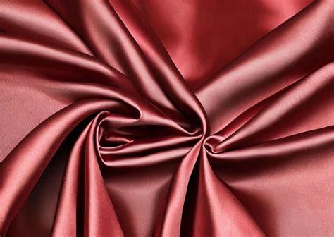 Premium Photo A Red Satin Fabric With A Swirl In The Middle