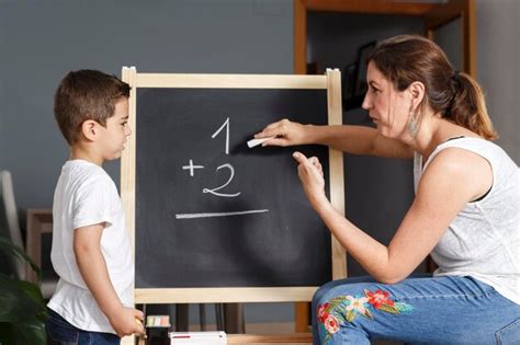 Premium Photo Mother And Son On Table