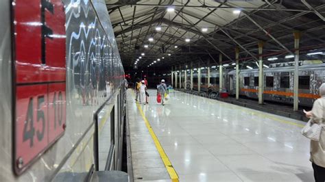 Passengers Walk And Enter The Train At Bandung Train Station Stock