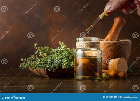 Bottle Of Thyme Essential Oil With Fresh Thyme Stock Image Image Of