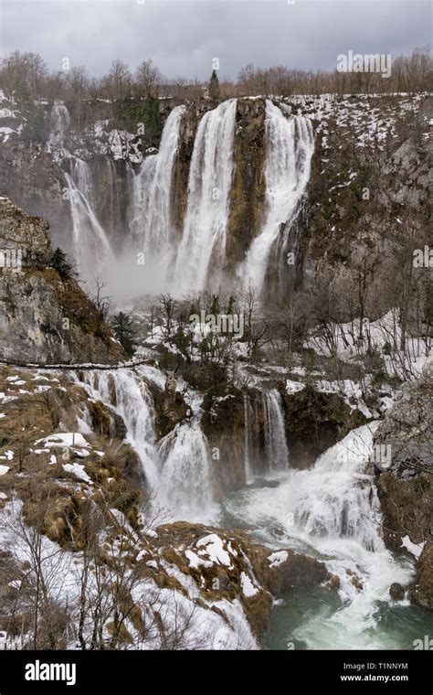 Vertical Picture Of The Big Waterfall In The Plitvice National Park In