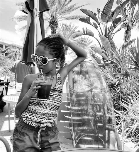 Premium Photo Girl Having Drink By Inflatable Ring