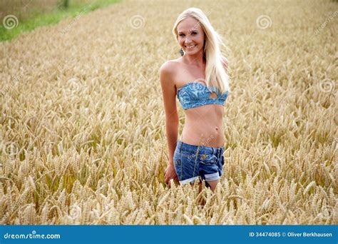 Young Woman Standing In A Cornfield Stock Image Image Of Spring Girl