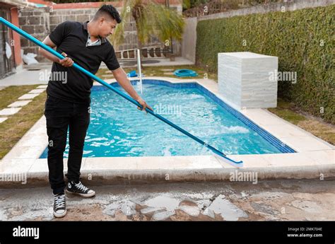 Swimming Pool Cleaning With Brush Maintenance Person Cleaning Swimming
