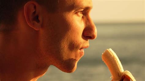 Man Eating Banana Stock Video Footage For Free Download