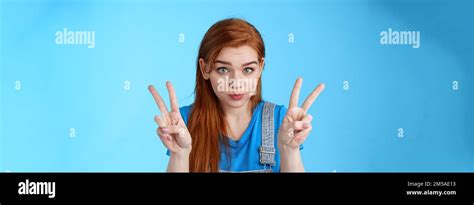 Playful Cute Silly Redhead Girlfriend Making Funny Face Show Peace