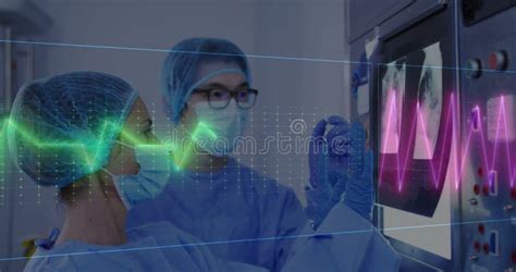 Analyzing Patient Data With Heartbeat Animation Medical Professionals Working Together Stock