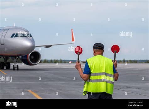 Airplane Marshalling At The Airport Apron Passenger Aircraft Meeting