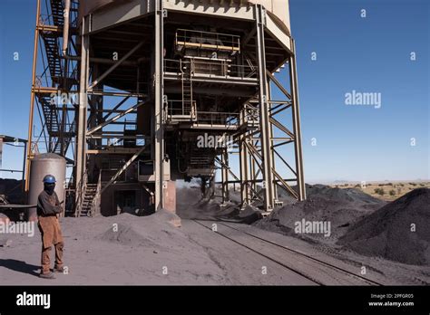 Miner Waiting To Load The Iron Ore Train At The Snim Open Pit Iron Ore