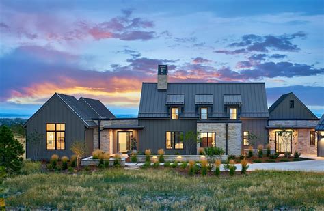 Contemporary Farmhouse With Dark Siding And Stone Exterior Modern