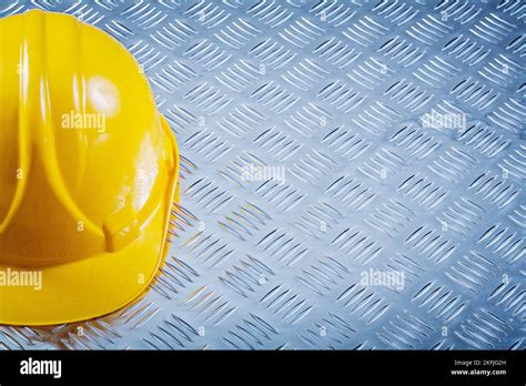 Protective Building Helmet On Chequered Metal Sheet Copy Space