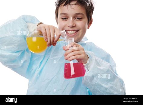 Selective Focus On Laboratory Glass Flasks In The Hands Of A Cute
